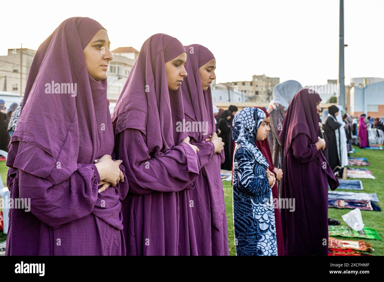 Muslim women pray during the Eid Al Adha celebrations. Muslim ...