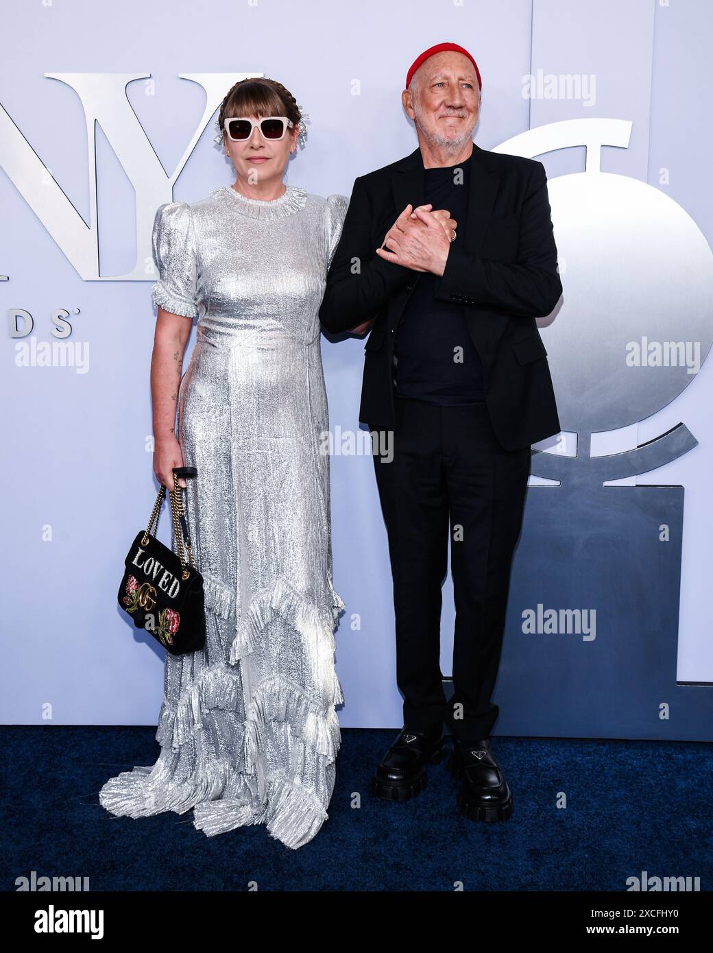 Rachel Fuller and Pete Townshend walking on the red carpet at the 77th ...