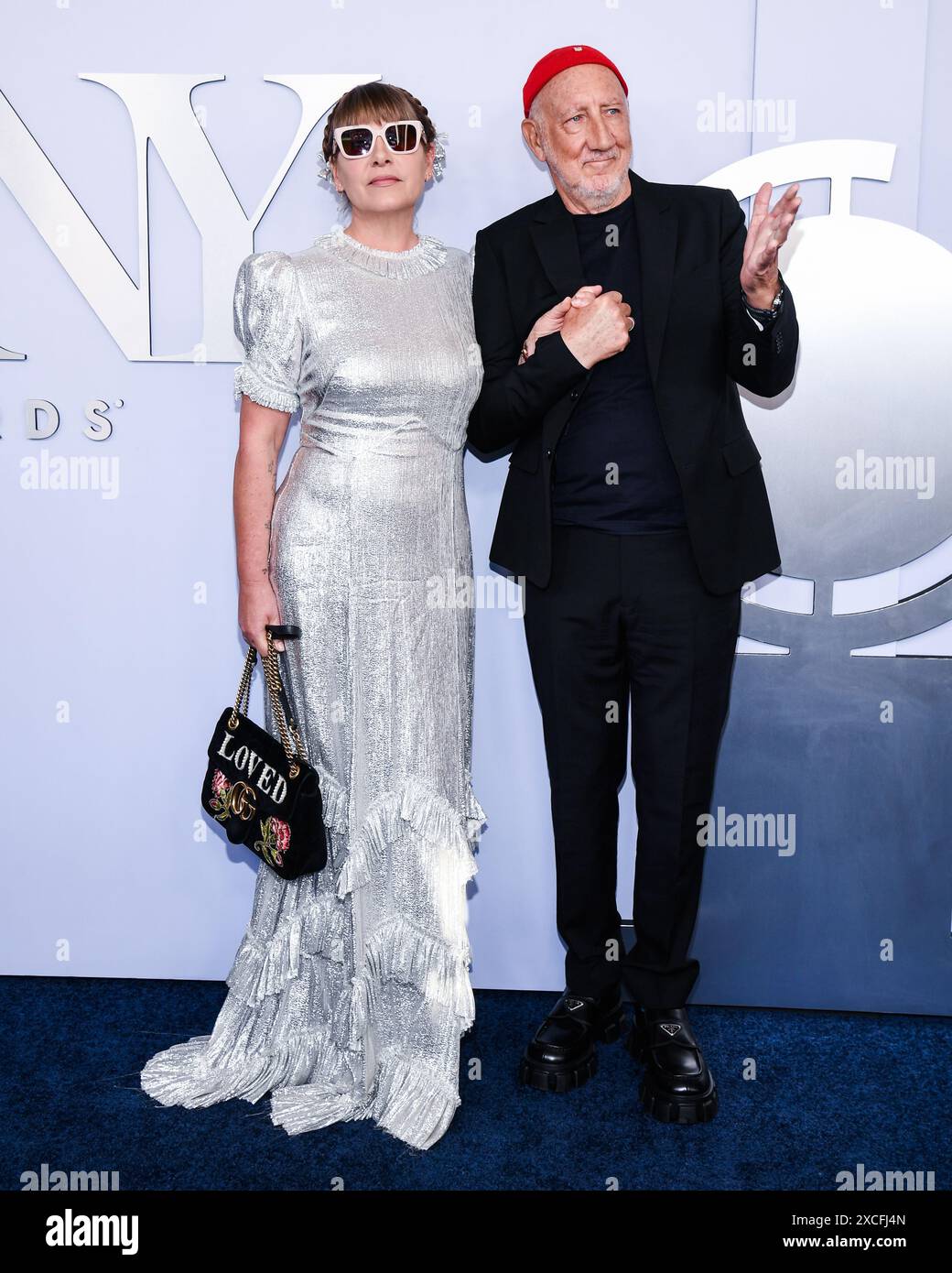 Rachel Fuller and Pete Townshend walking on the red carpet at the 77th ...