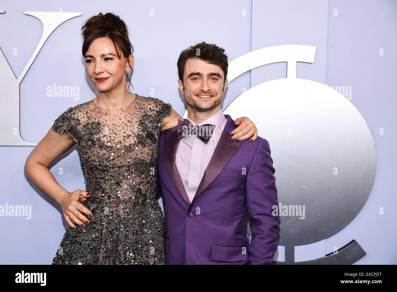 Erin Darke and Daniel Radcliffe walking on the red carpet at the 77th ...