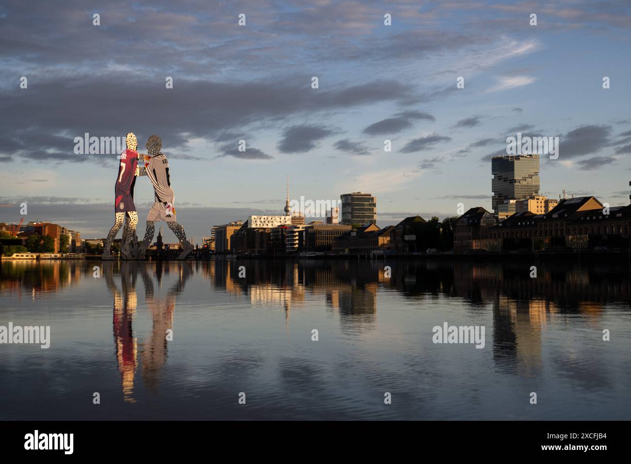 17 June 2024, Berlin: The "Molecule Man" statue by US sculptor Jonathan ...
