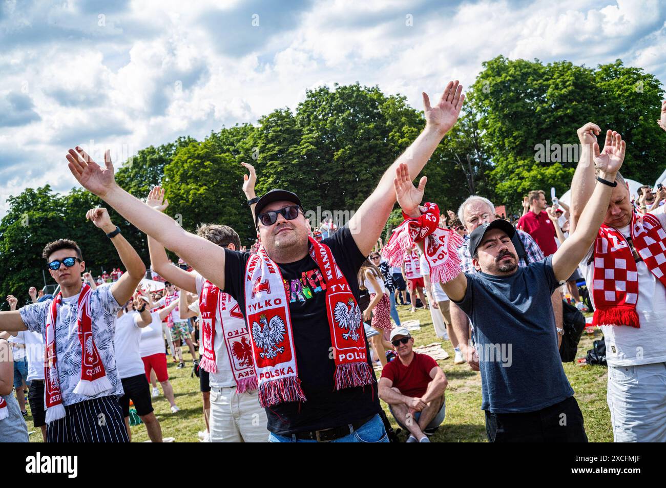 Warsaw, Poland. 16th June, 2024. Polish football fans are led in the ...