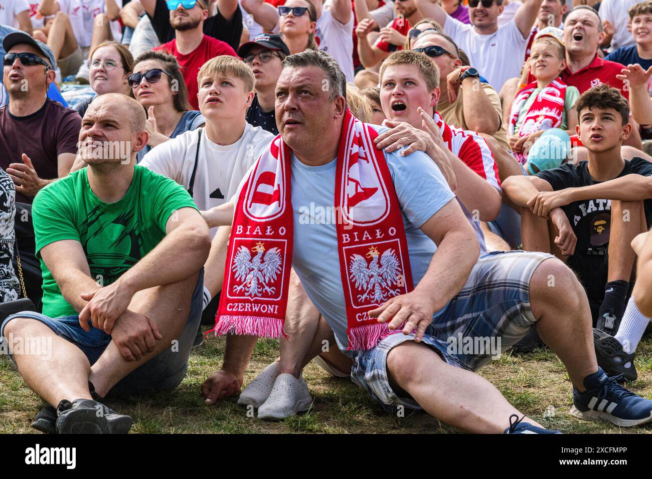 Warsaw, Poland. 16th June, 2024. Polish fans look on with excitement as ...