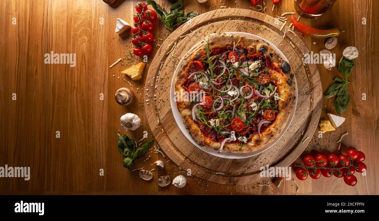 Rustic homemade pizza on wooden table with space of your text Stock ...