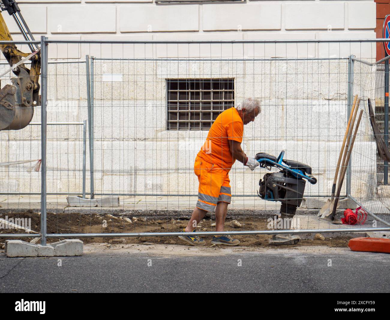 Cremona, Italy - June 10th 2024 Construction worker wearing orange ...