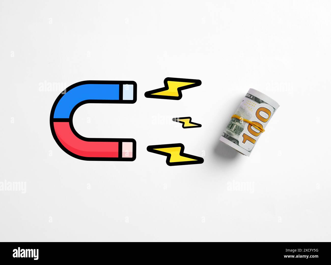Magnet attracting a bankroll of dollar bills on white background ...