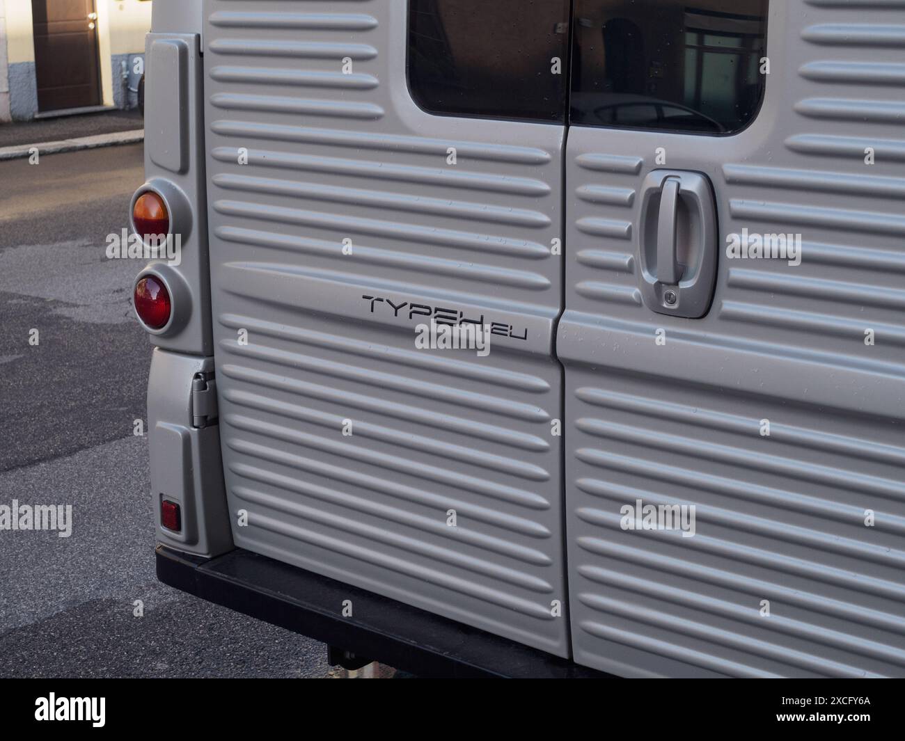 Cremona, Italy - June 10th 2024 Detail of a corrugated metal door with ...