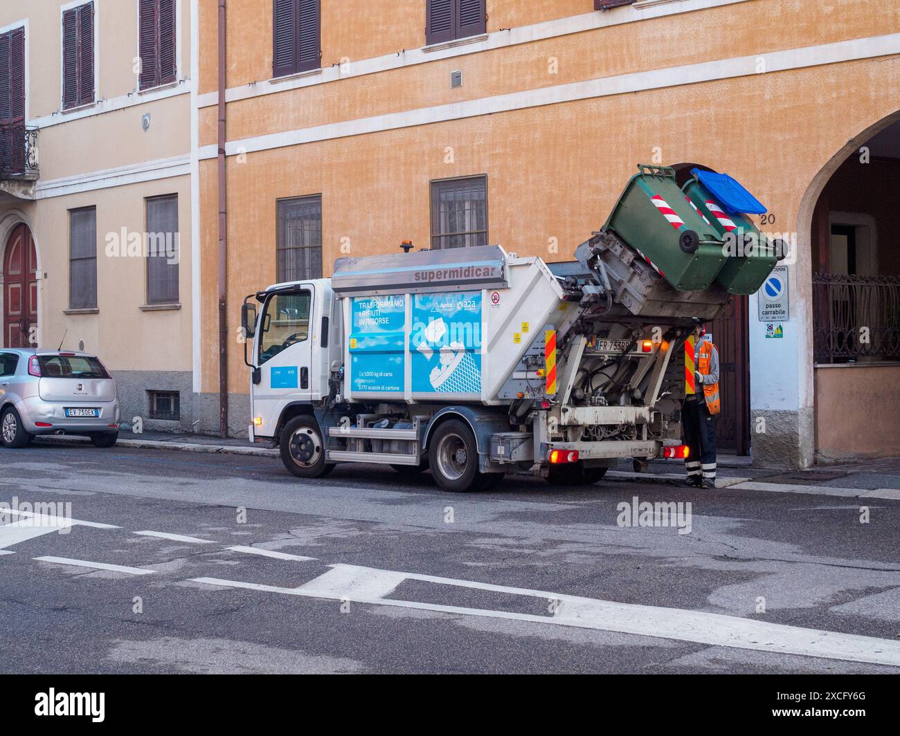 Cremona, Italy - June 10th 2024 Garbage truck collecting trash bins ...