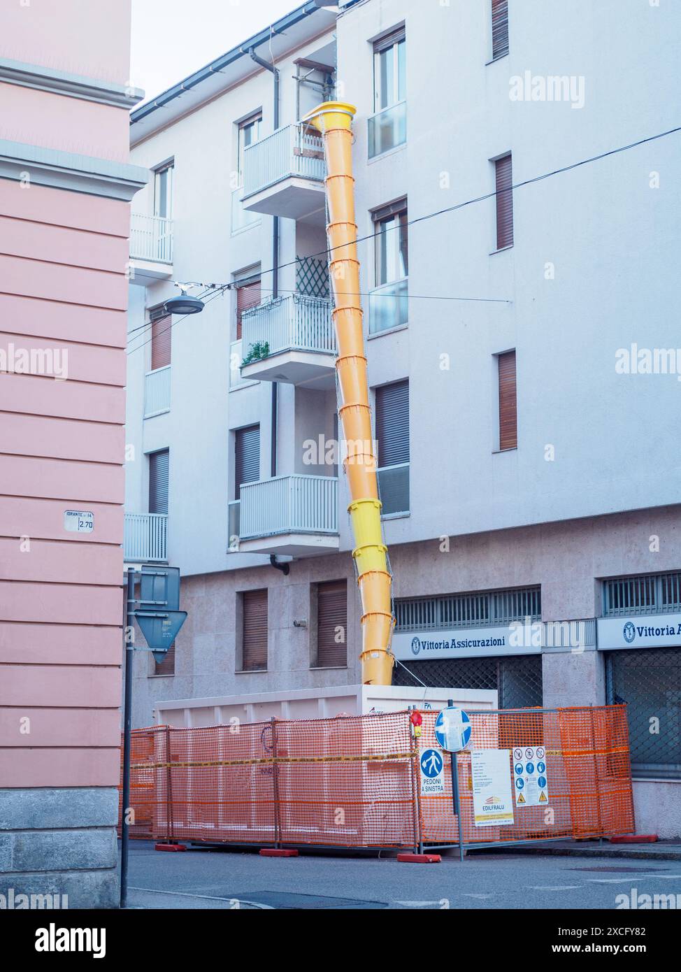 Cremona, Italy - June 10th 2024 Yellow debris chute removing ...