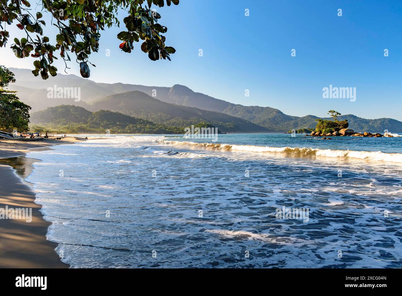 Remote Castelhanos beach on Ilhabela island with mountains and forest ...