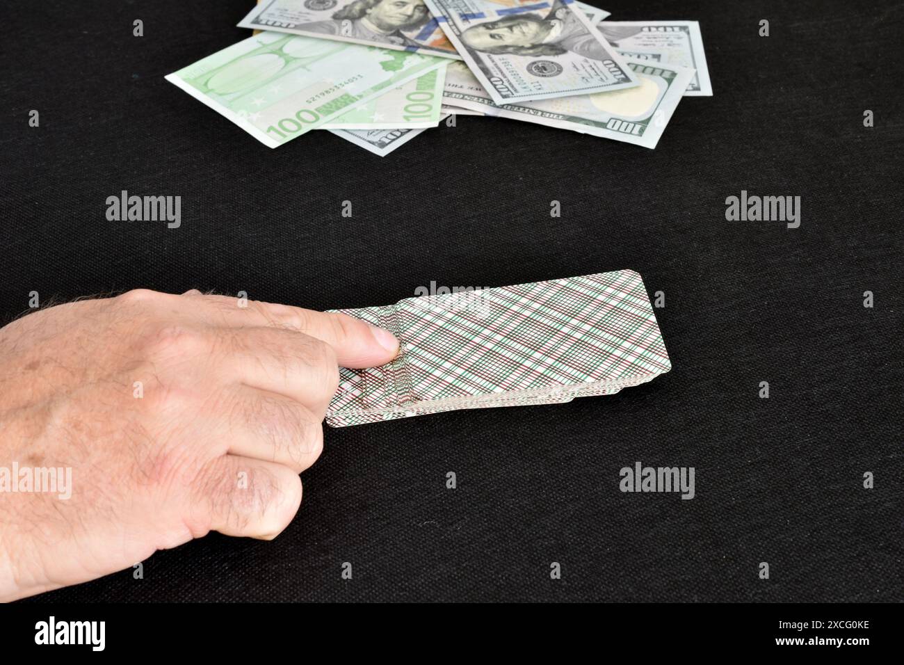 The picture shows the player's hand on a deck of cards and a pile of ...
