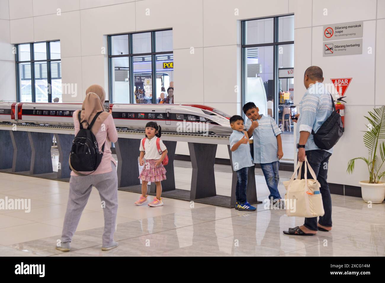 Jakarta, Indonesia. 17th June, 2024. Children pose for photos with a model of a high-speed ...