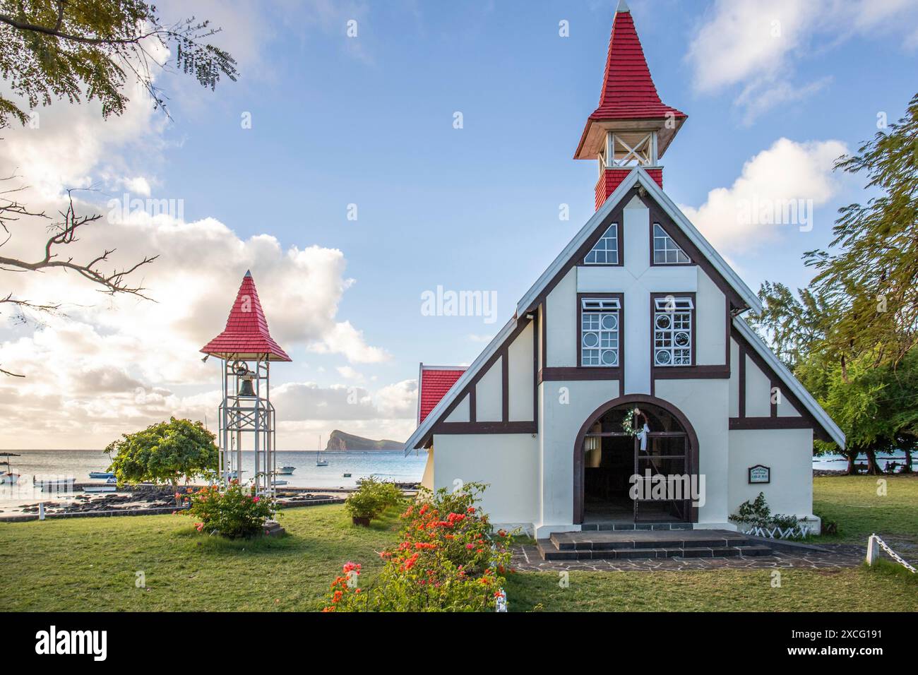 Landscape with a view over a small church with a red roof. Bay and ...