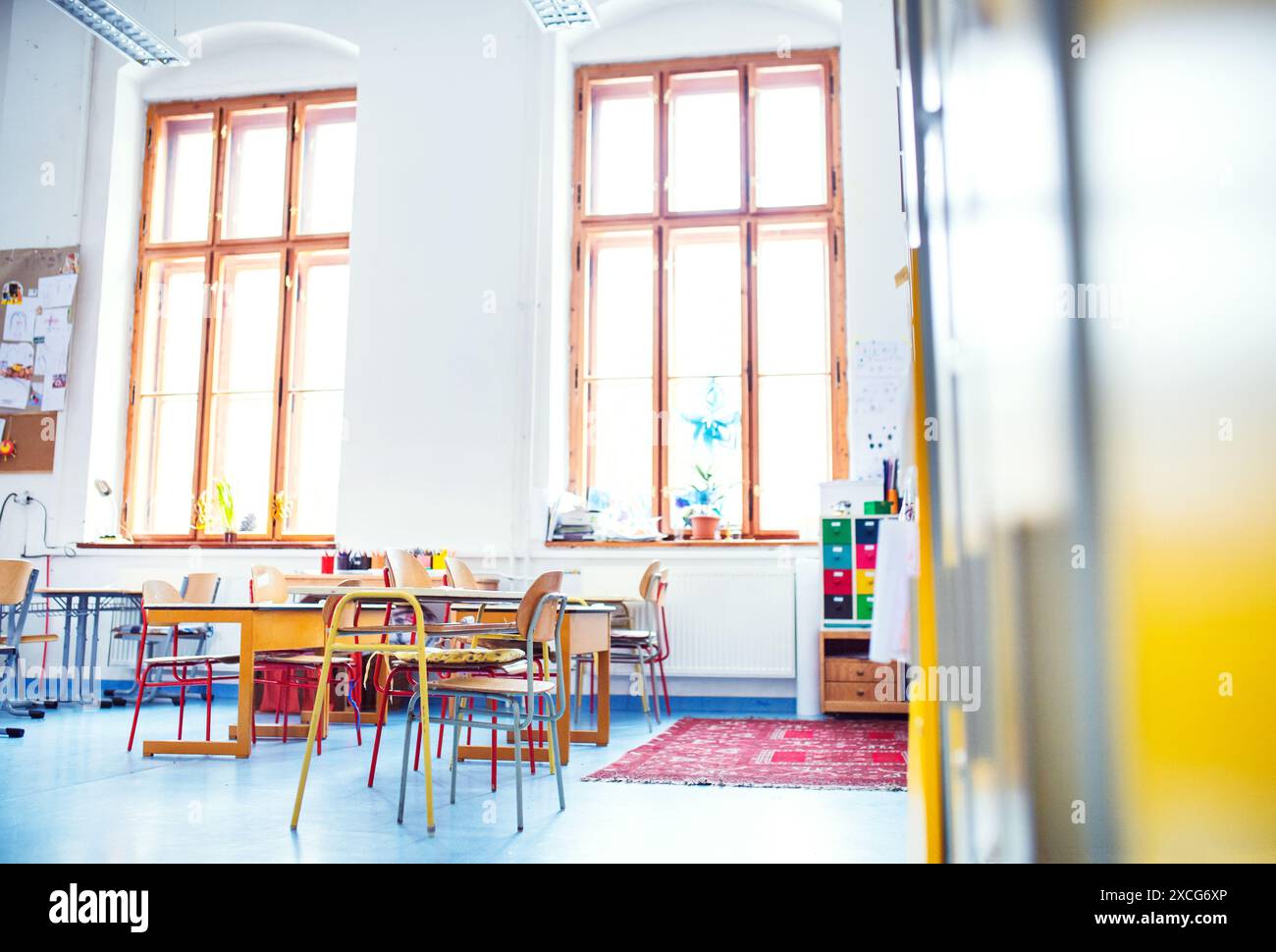 Elementary classroom with big windows, no students. Last day of school ...