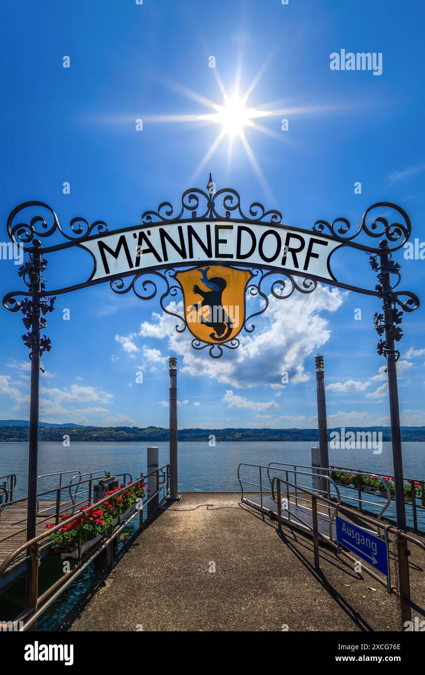 Mannedorf, Switzerland - June 13, 2024: Serene lakeside with MANNEDORF ...