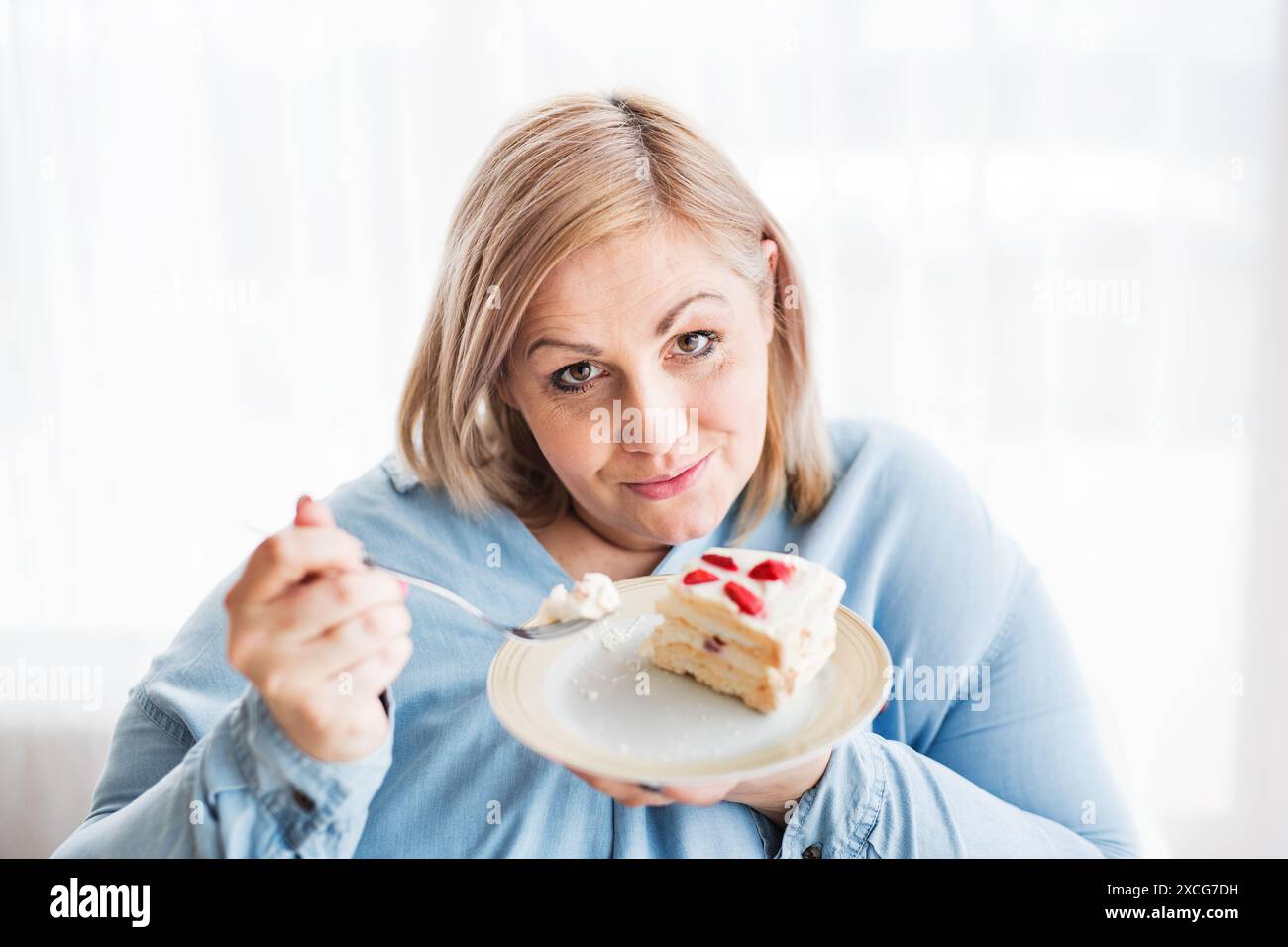 Fat woman eating slice cake hi-res stock photography and images - Alamy