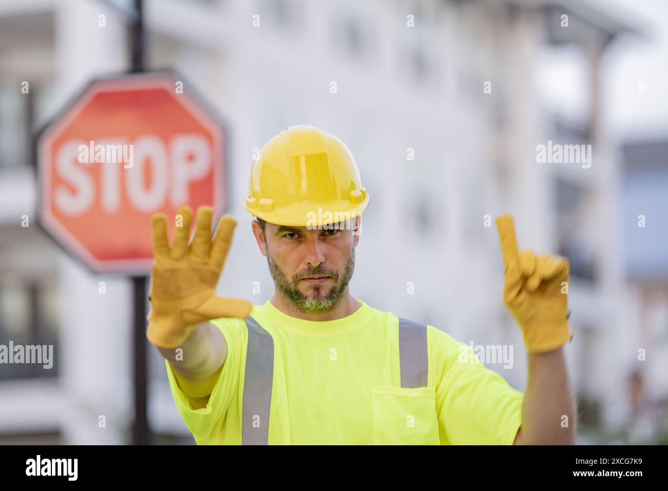Stop road sign. Builder with stop gesture, no hand, dangerous on ...