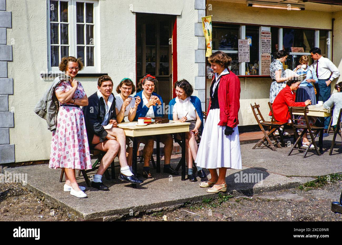 Group of young people sitting outside a cafe, 1950-1955, England, UK ...