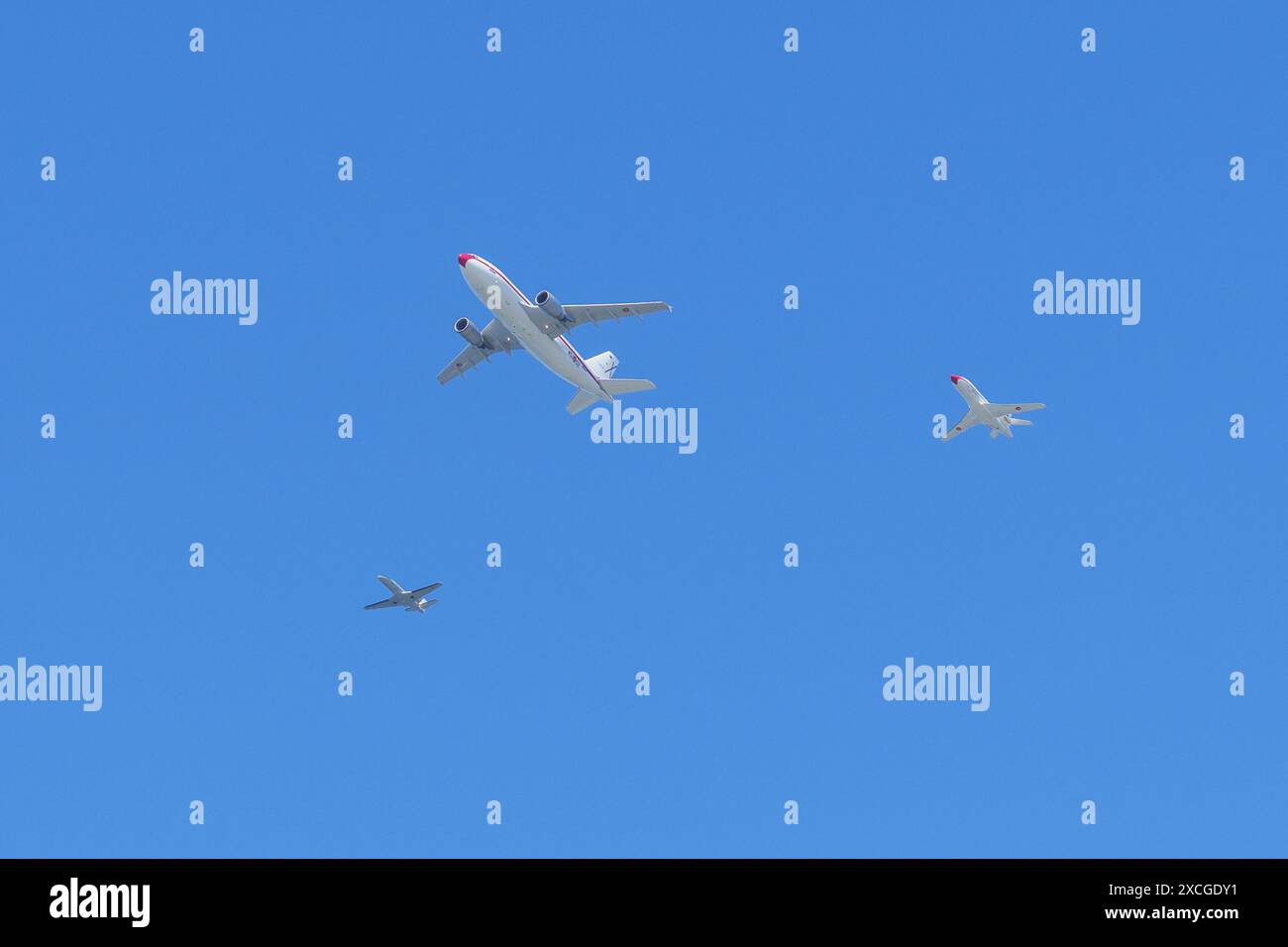 Gijon, Spain - May, 24, 2024: Three airplanes fly in formation against ...