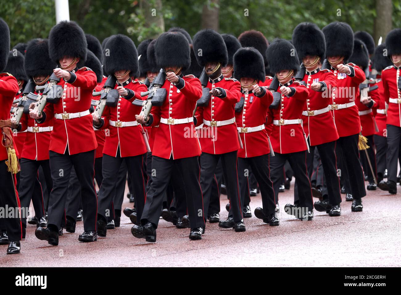 Coldstream Guards march up The Mall. The Royal family including King ...
