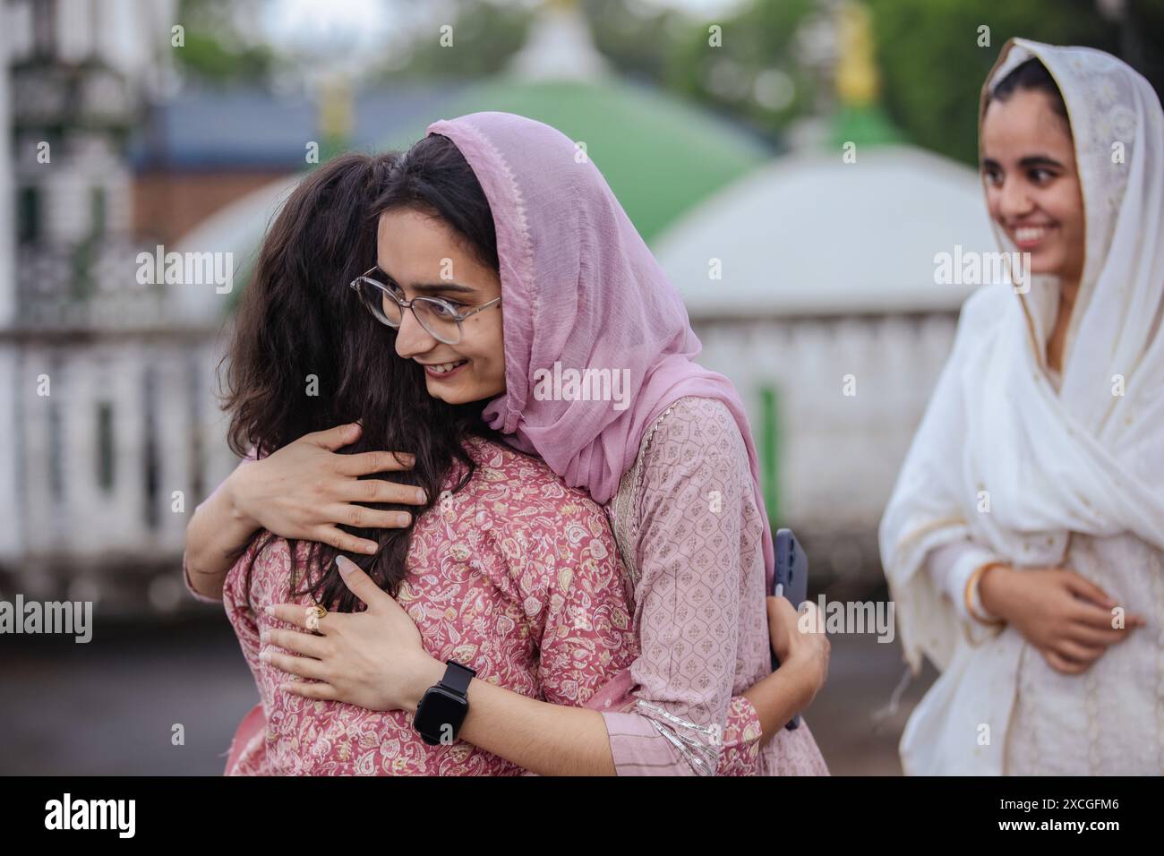 Kathmandu, Nepal. 17th June, 2024. Muslim women hug each other as they exchange greetings after ...