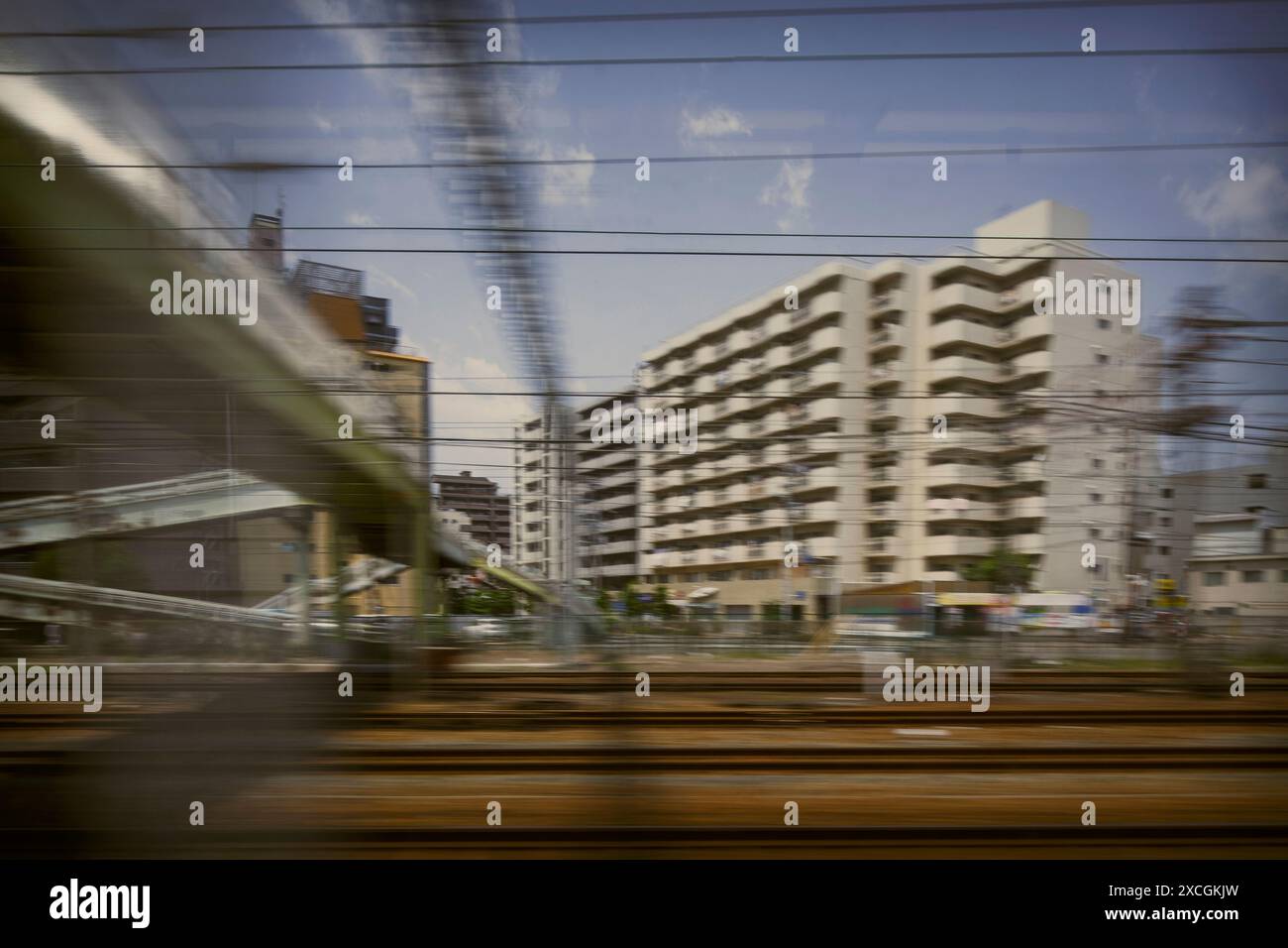 A blurry view of Japan bullet train on its elevated track and nice ...