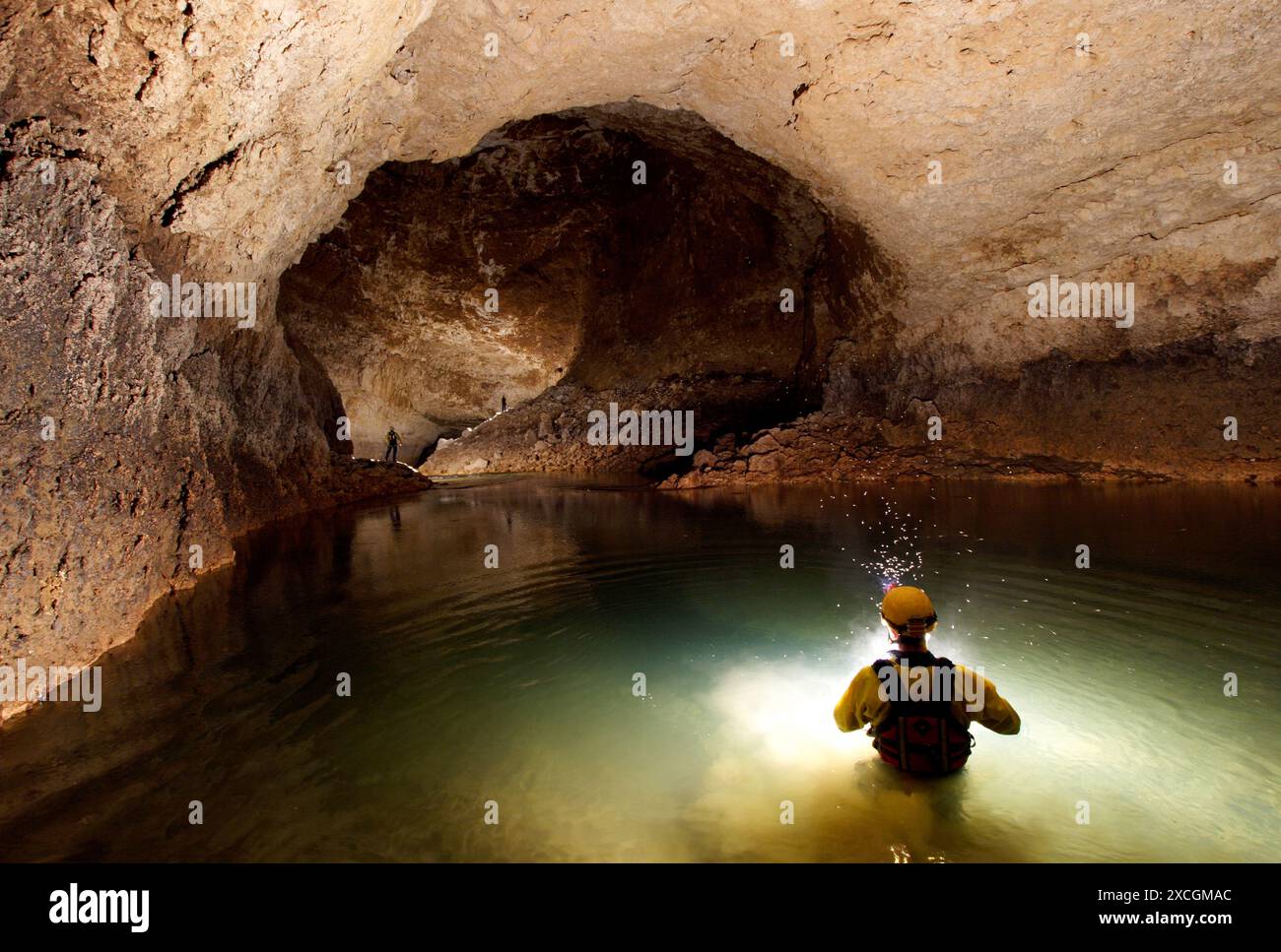 Self portrait in a ginat slow moving river passage in a cave in New ...