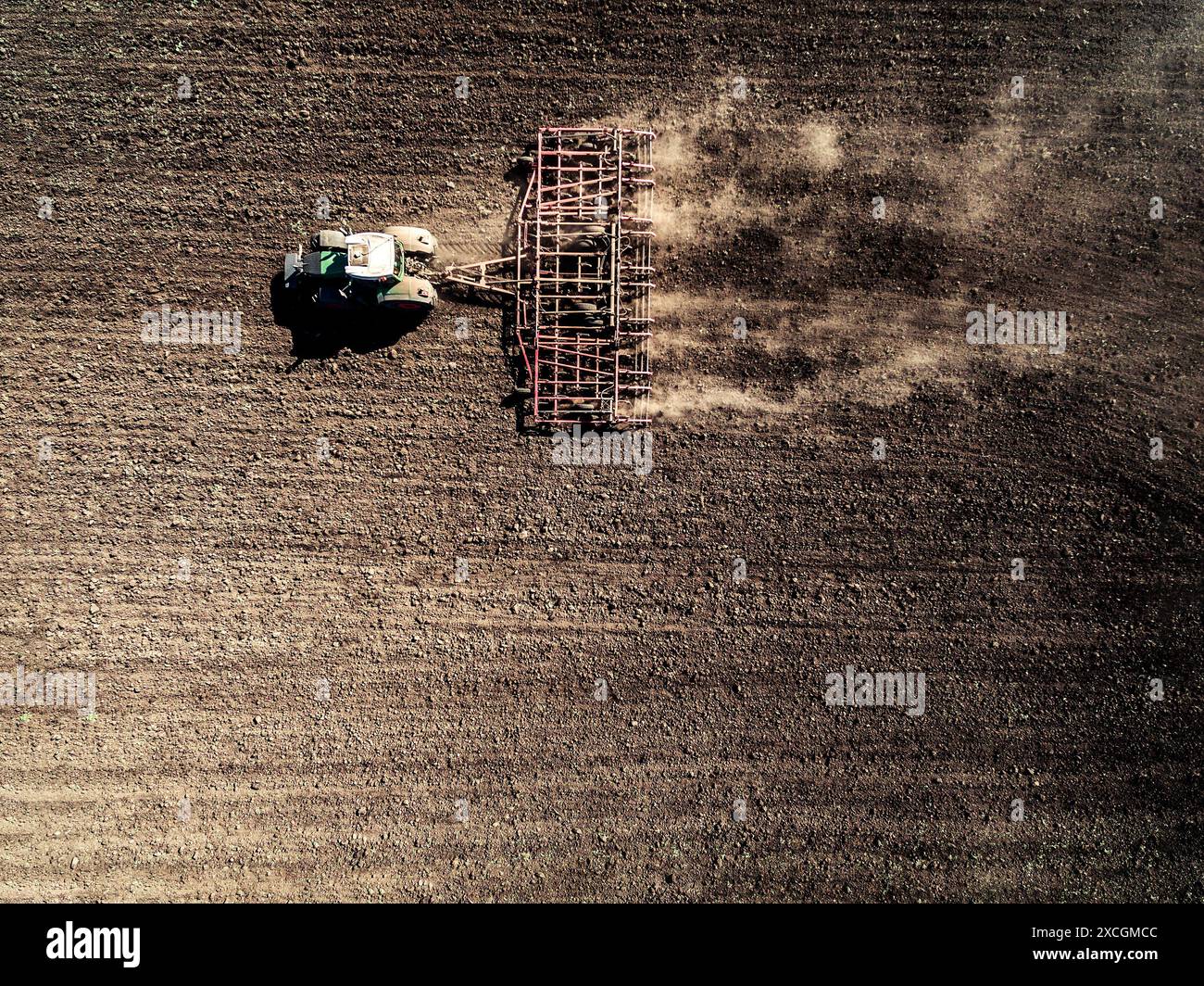 Agricultural machinery plowing large farmland hi-res stock photography ...