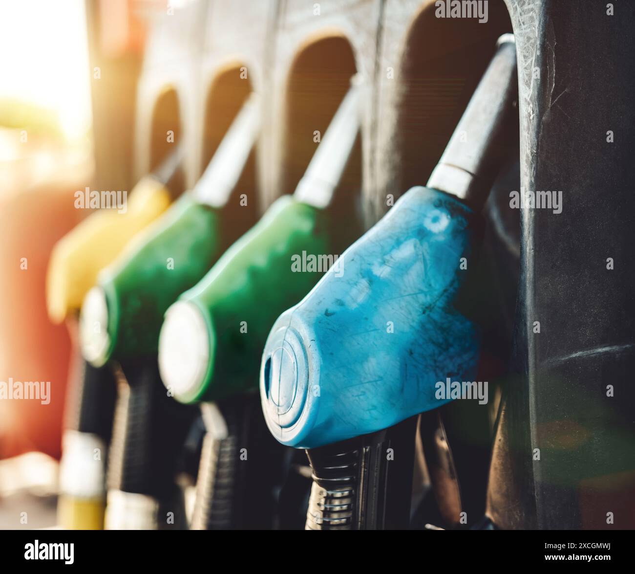 Fuel pump filling nozzles at Gas station, close up view Stock Photo - Alamy
