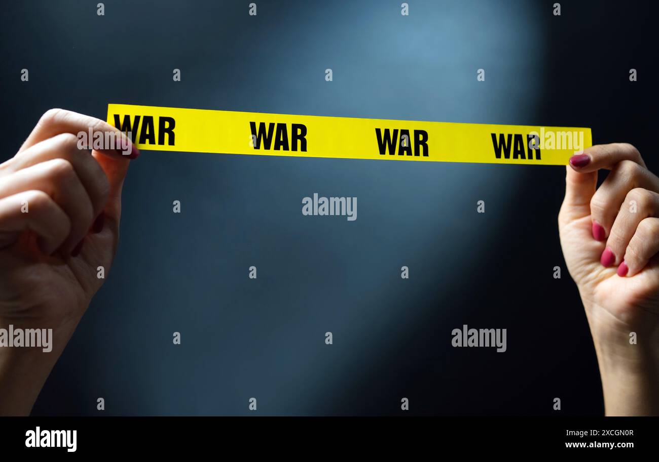 Warning Hands Holding Yellow Tape With War Text As Symbol Of Safety And ...