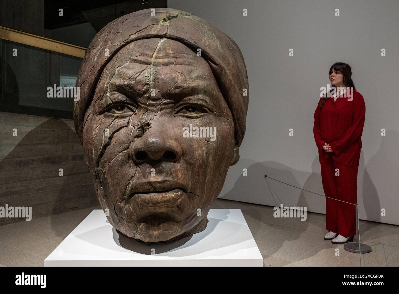 London, UK. 17 June 2024. A staff member with 'Ruin of a Giant (Harriet ...