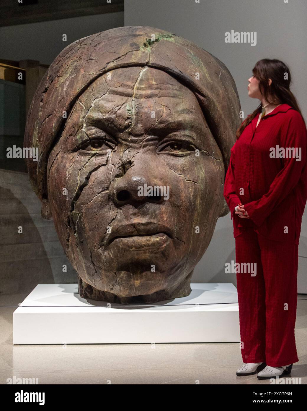 London, UK. 17 June 2024. A staff member with 'Ruin of a Giant (Harriet ...