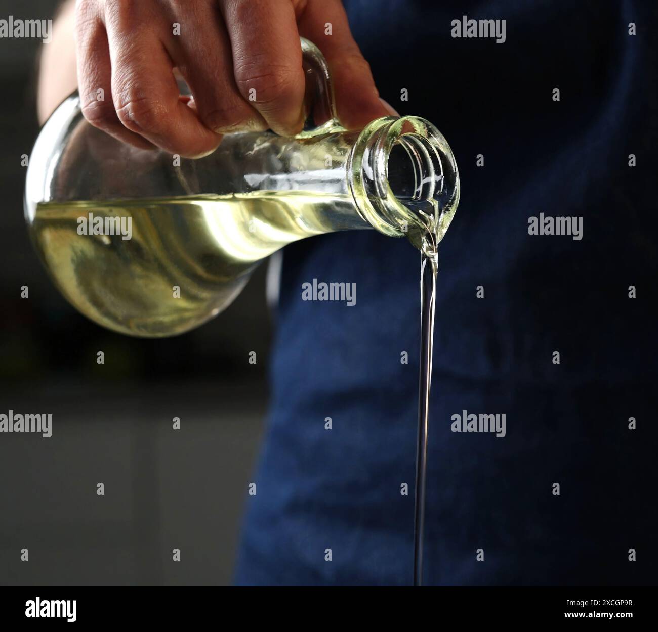 Girl Pouring Oil While Cooking Food, Vegetable Oil Is Poured From A Jug ...