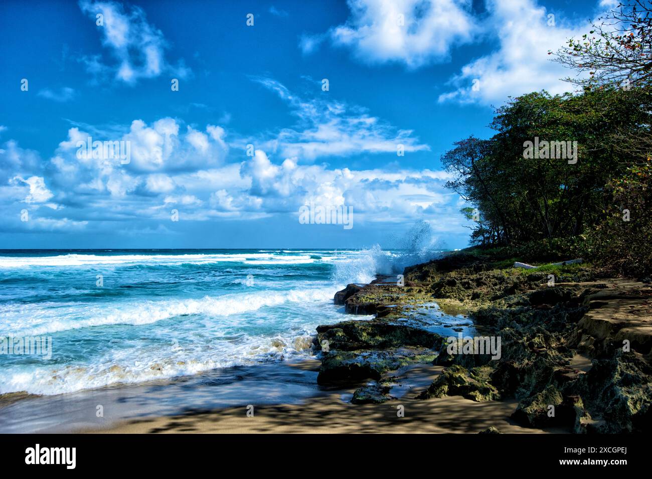 Waves from the Caribbean slam against the beach in Cabarete, Dominican ...