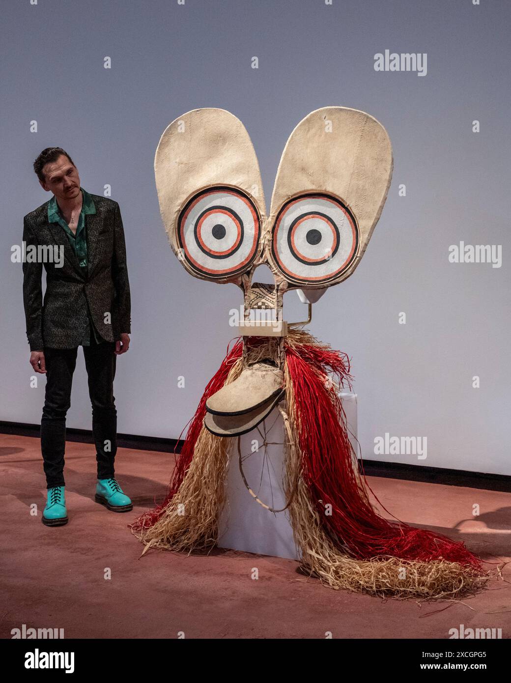 London, UK. 17 June 2024. A staff member with 'Distant Relatives (Derek ...