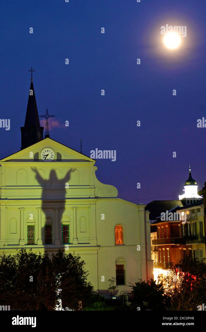 Statue of Jesus Christ casts a shadow on the back of St Louis Cathedral ...