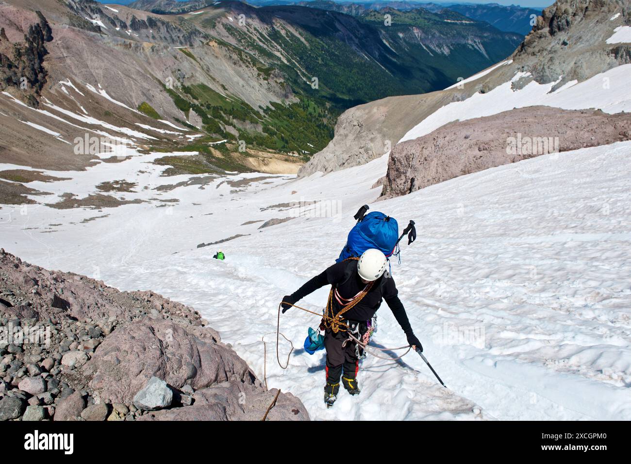 Mountain climber making way up Inter Glacier of Mount Rainier towards ...