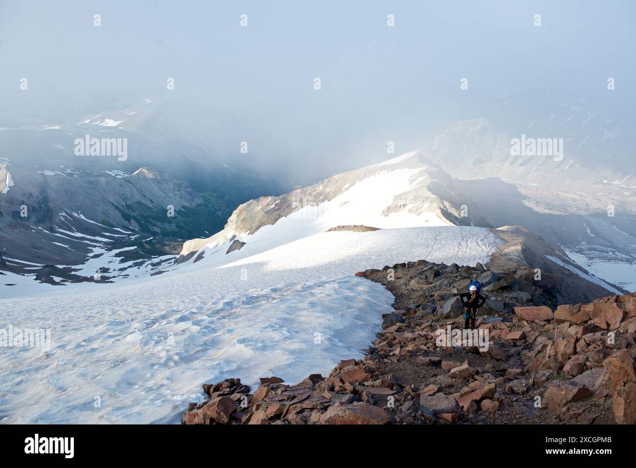 Mountain climber making way up Inter Glacier of Mount Rainier towards ...