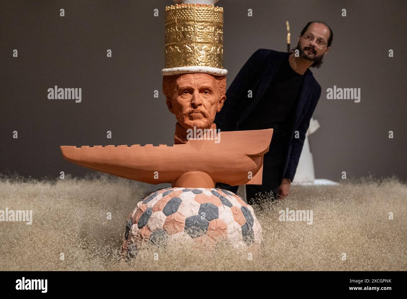 London, UK. 17 June 2024. A staff member with (detail) 'Jah Rastafari ...
