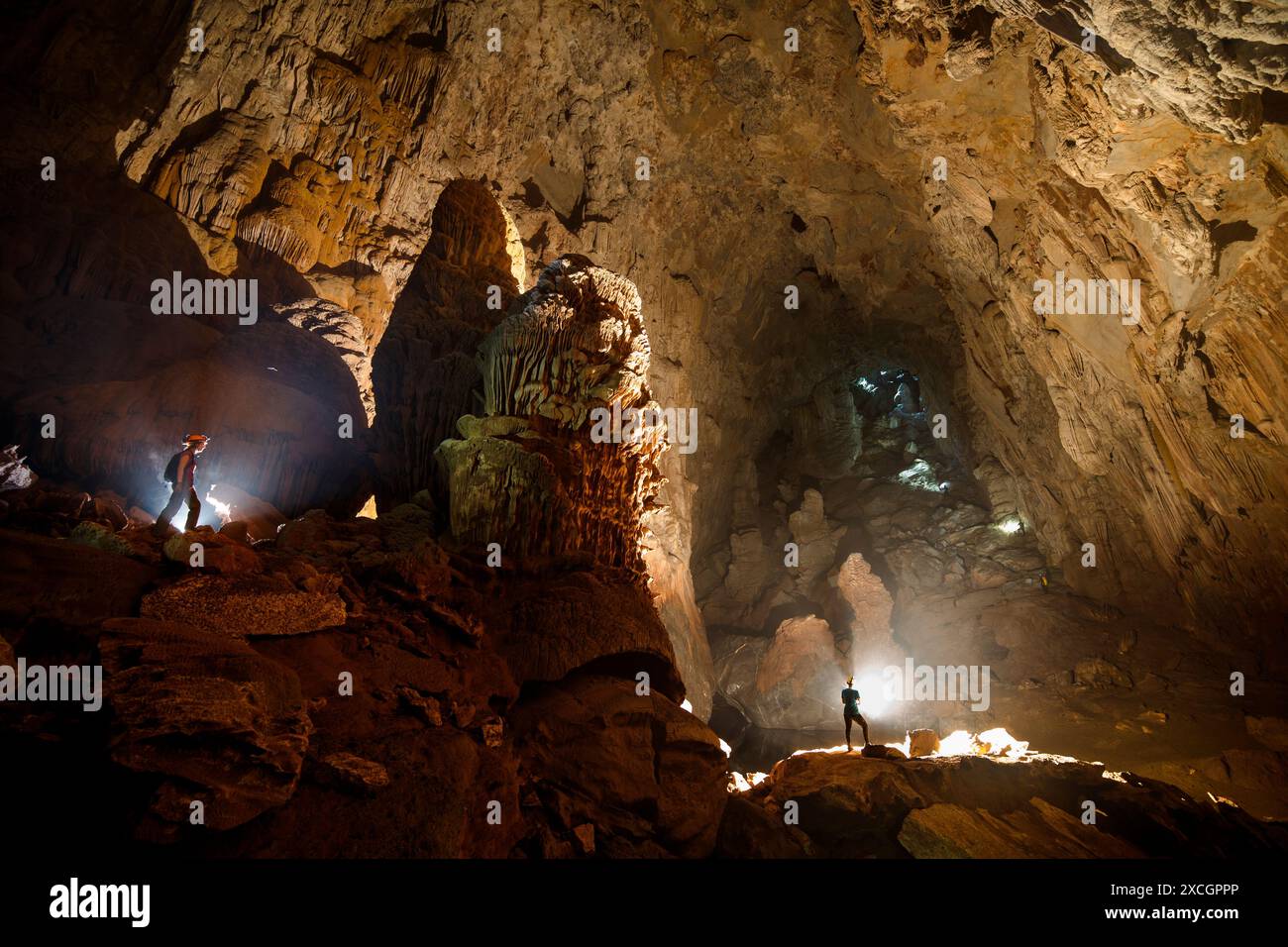 Cave explorers make their way to the exit of Hang Son Doong Stock Photo ...