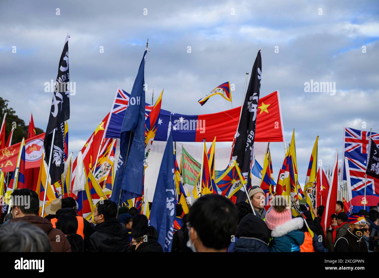 Protesters from the Tibet, Hong Kong, East Turkistan community waving ...