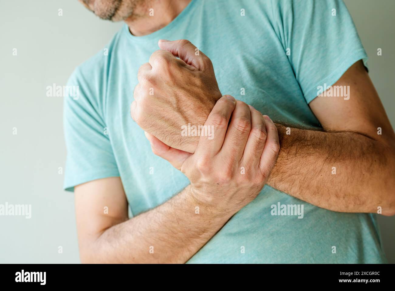 Severe wrist pain symptoms, man with painful medical condition ...