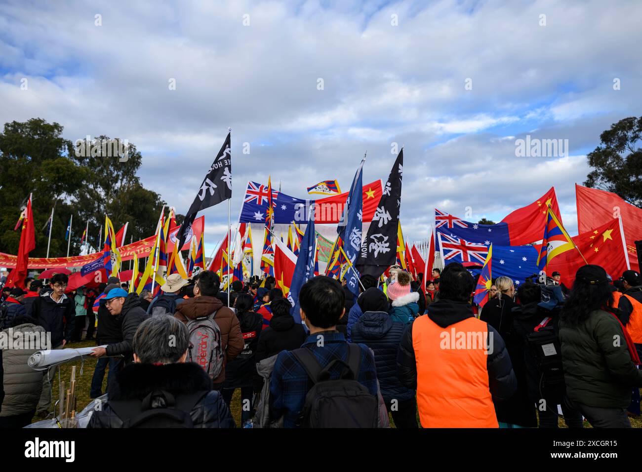 Protesters from the Tibet, Hong Kong, East Turkistan community waving ...