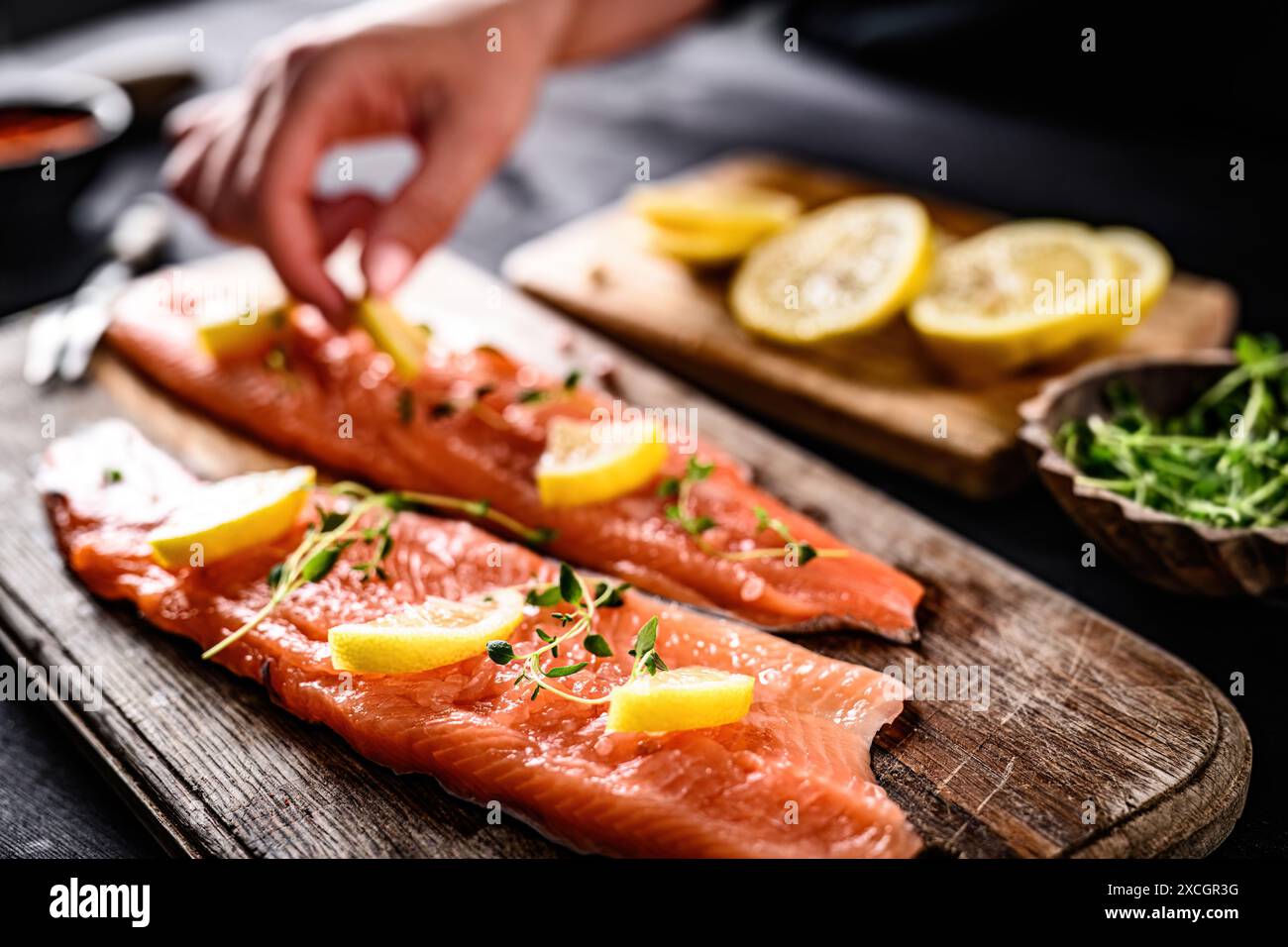 Girl cooking fish in hi-res stock photography and images - Alamy
