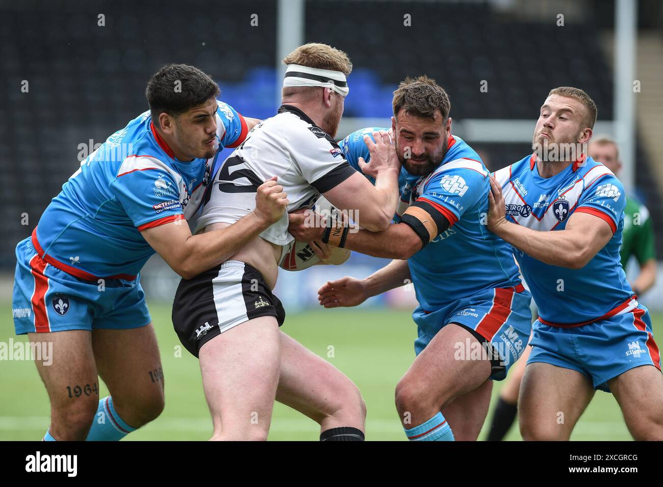 Widnes, England - 16th June 2024 - Wakefield Trinity's Caleb Uele, Josh ...