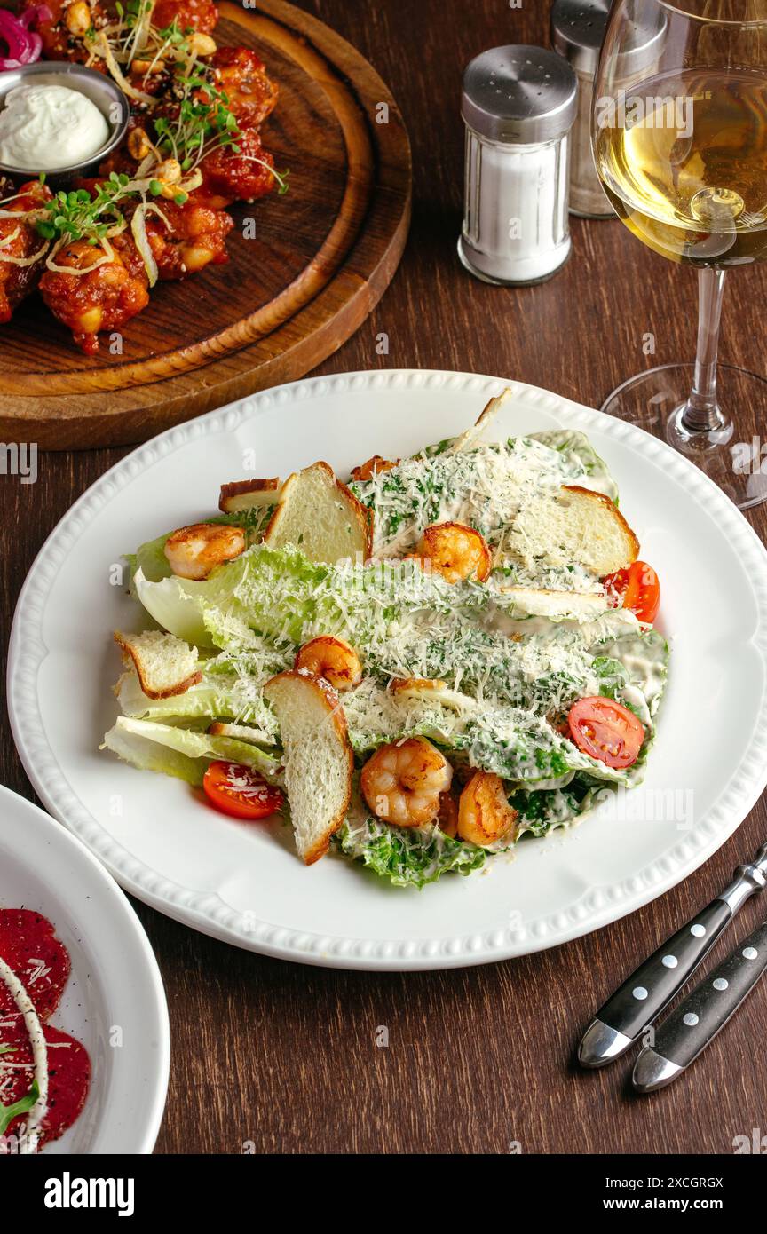 Caesar salad with shrimp and sauce. restaurant menu Stock Photo - Alamy