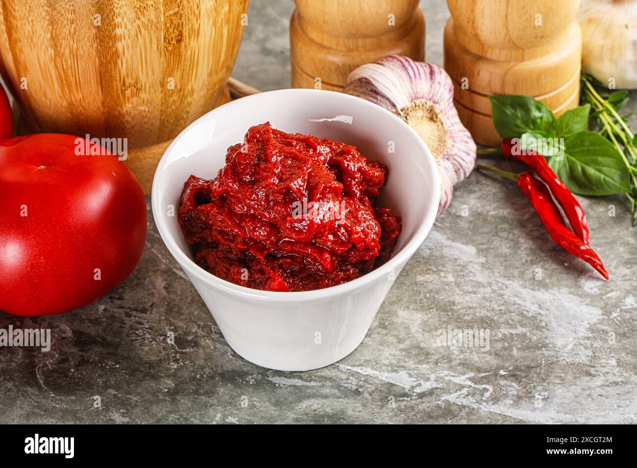 Natural organic red tomato paste in the bowl Stock Photo - Alamy