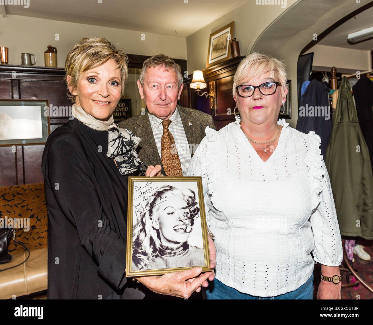Judi Spiers presenting a signed photo of the actress Belinda Lee, to ...