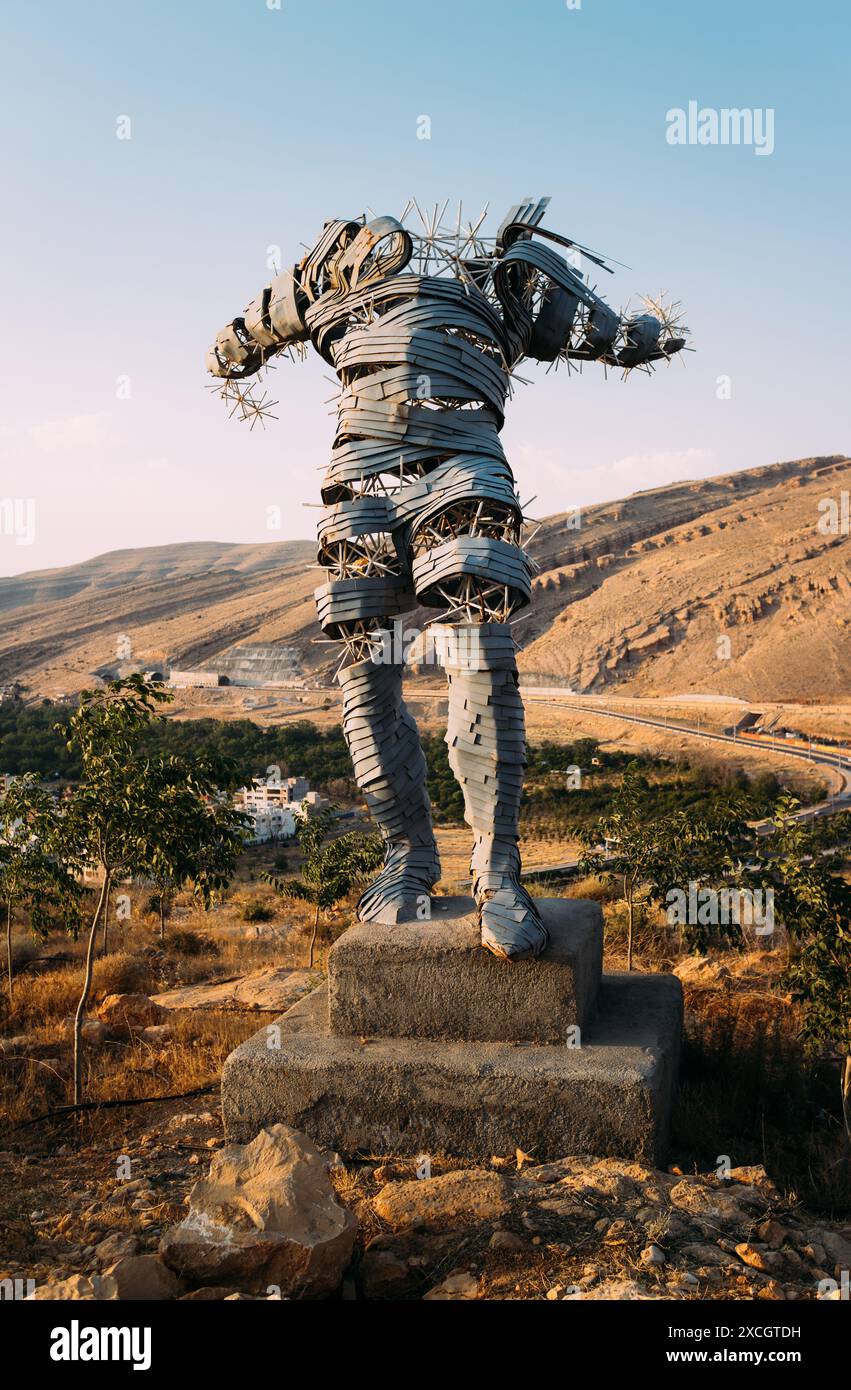 Metal sculpture of a headless man Stock Photo - Alamy