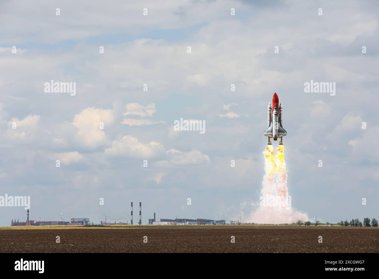 Launch of space rocket in field on sunny day Stock Photo - Alamy